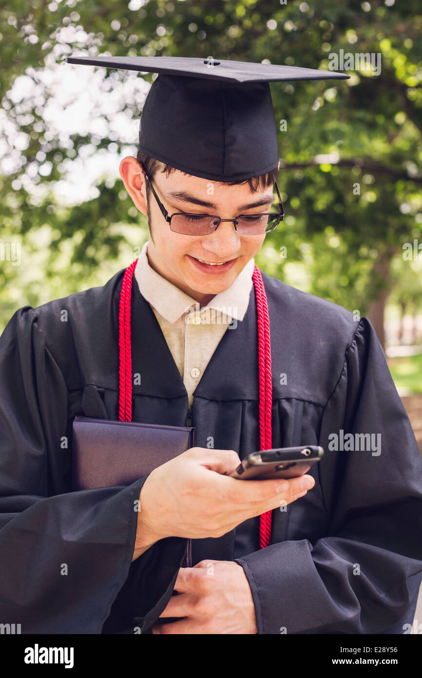 Highschool graduate after graduation caremony in the park Stock Photo ...