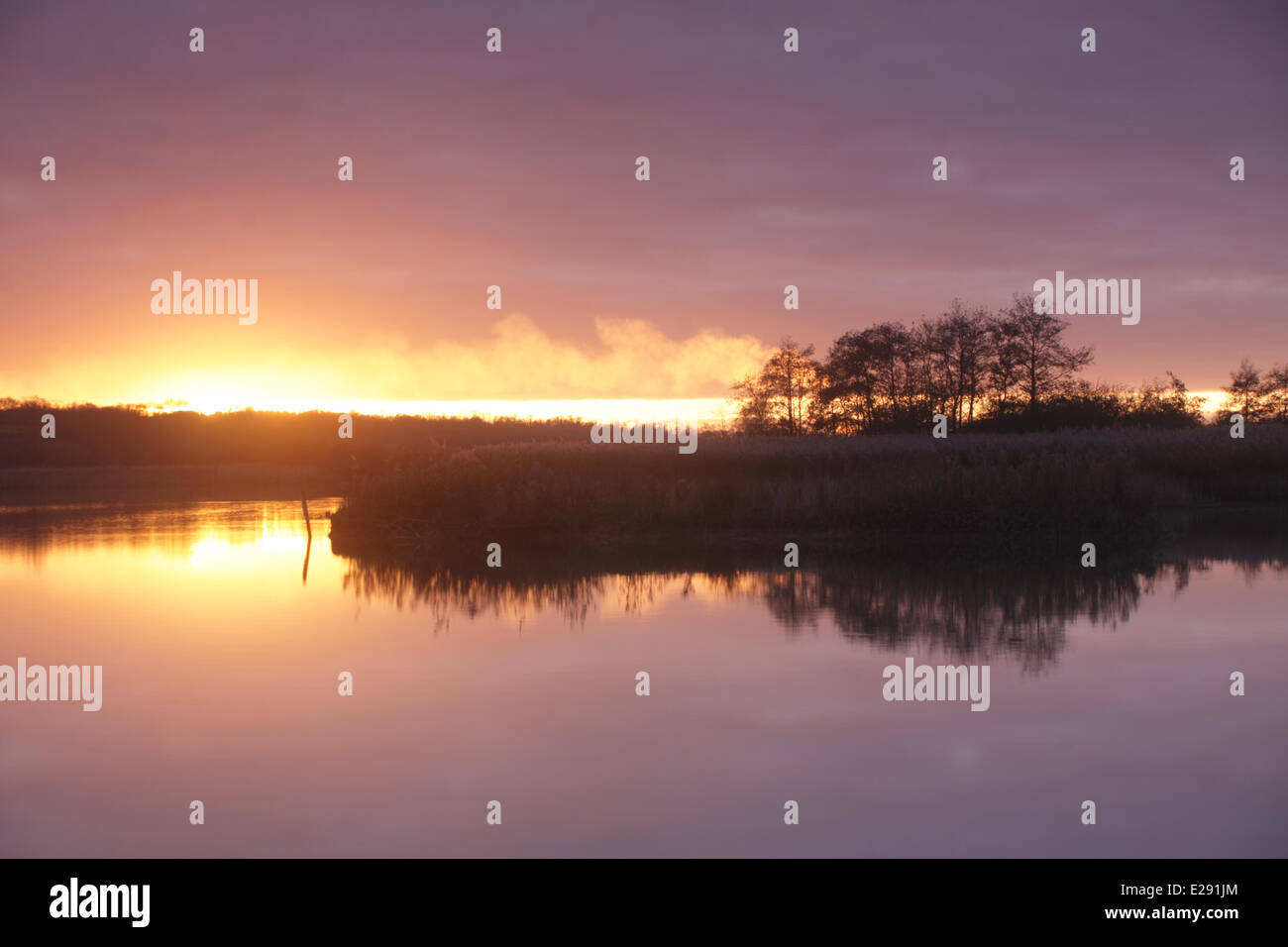 View of lake at sunset, Far Ings National Nature Reserve, Barton Upon ...
