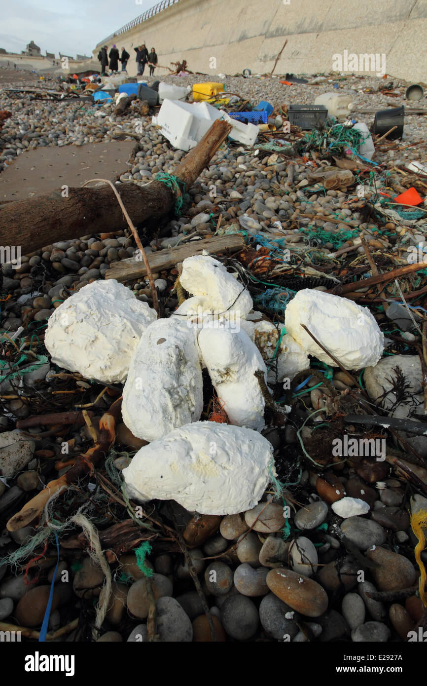 Rancid vegetable oil amongst rubbish washed up on beach, Chesil Beach ...