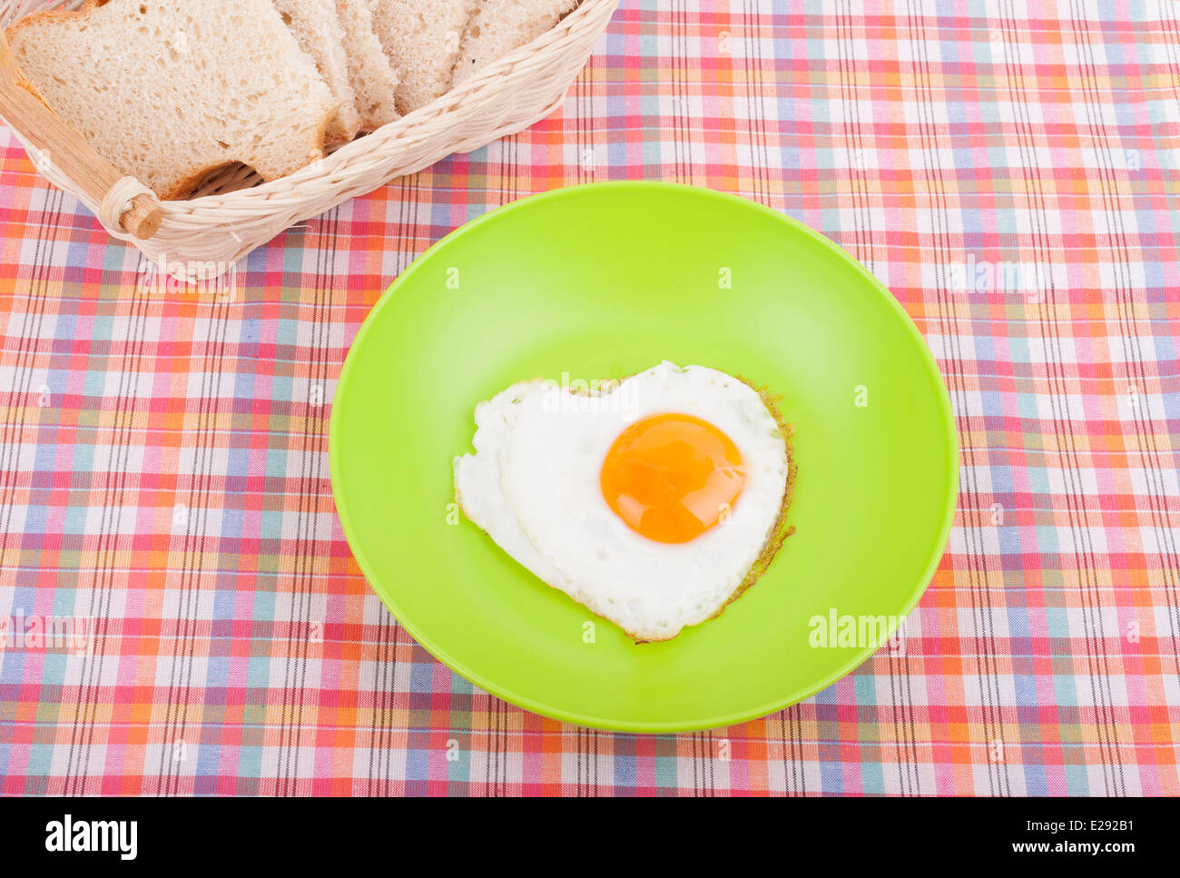 Scrambled in a heart shape on a plate Stock Photo - Alamy