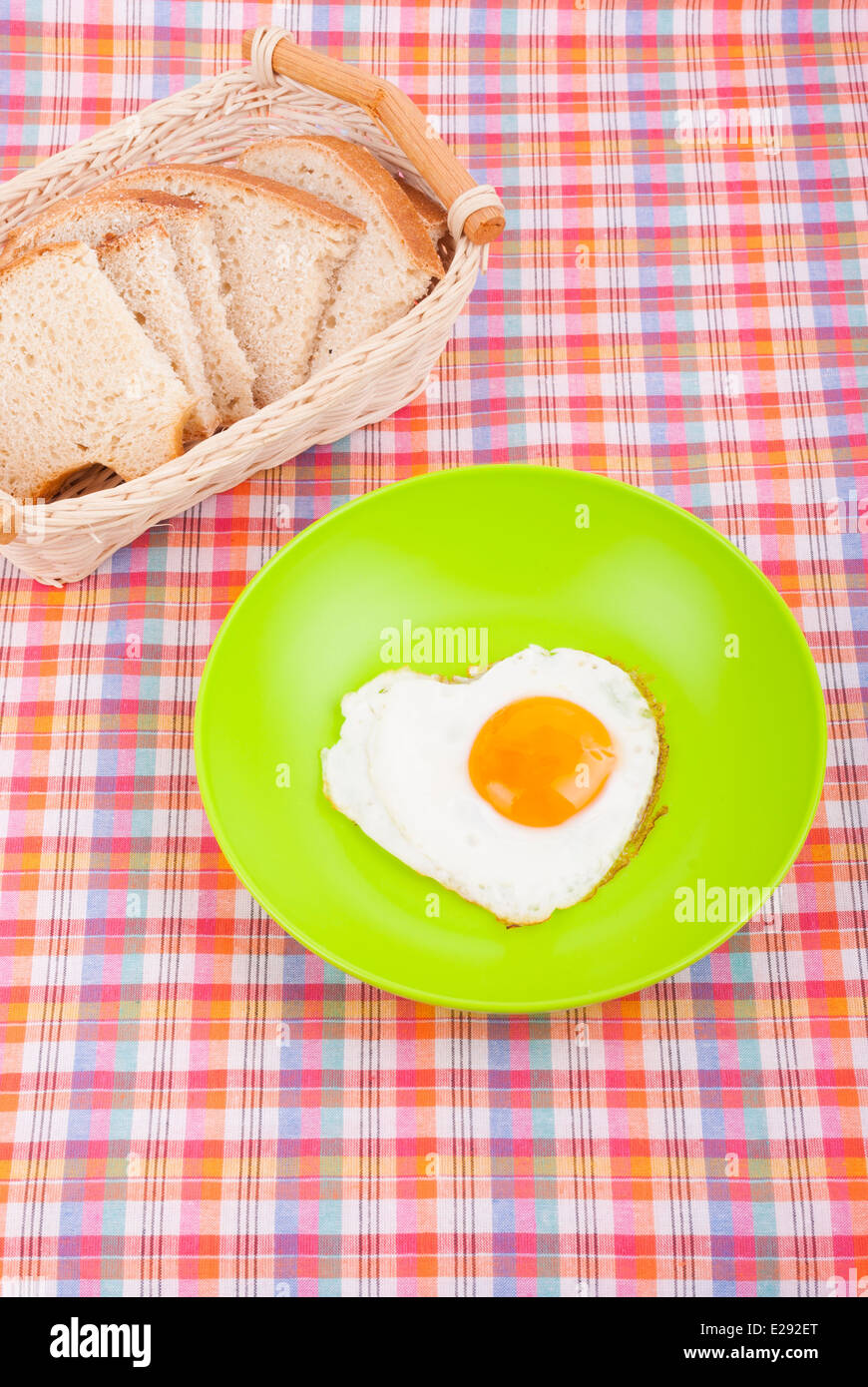 Scrambled in a heart shape on a plate Stock Photo - Alamy