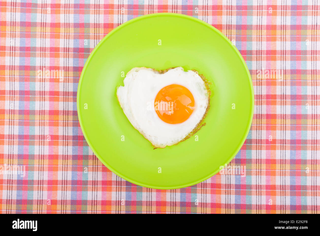 Scrambled in a heart shape on a plate Stock Photo - Alamy