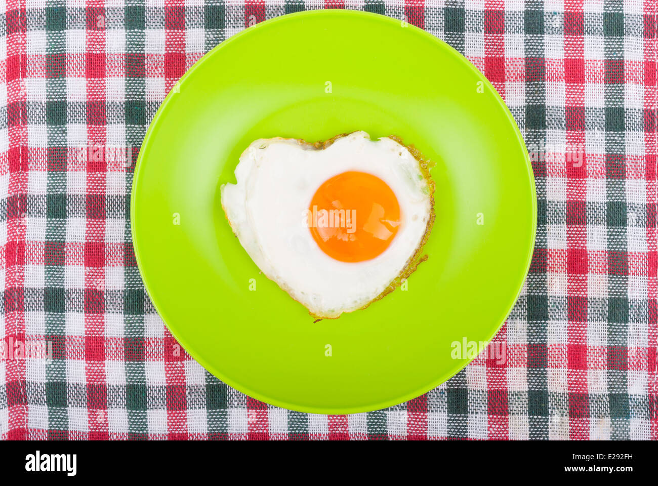 Scrambled in a heart shape on a plate Stock Photo - Alamy