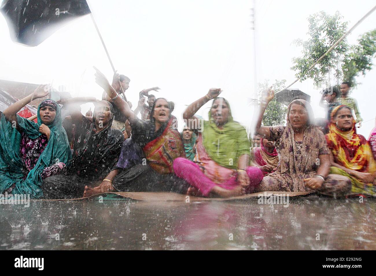 People protest after their houses were burnt following a clash at ...