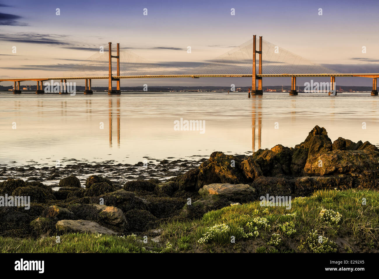 View of road bridge over river at sunrise, viewed from Black Rock near ...