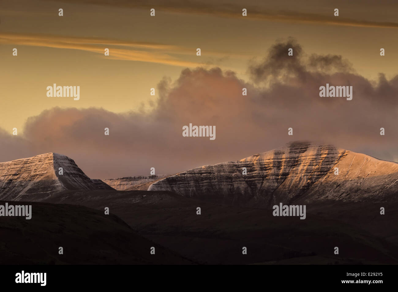 View of snow covered hills at sunrise, Penyfan and Corn Du, Brecon ...