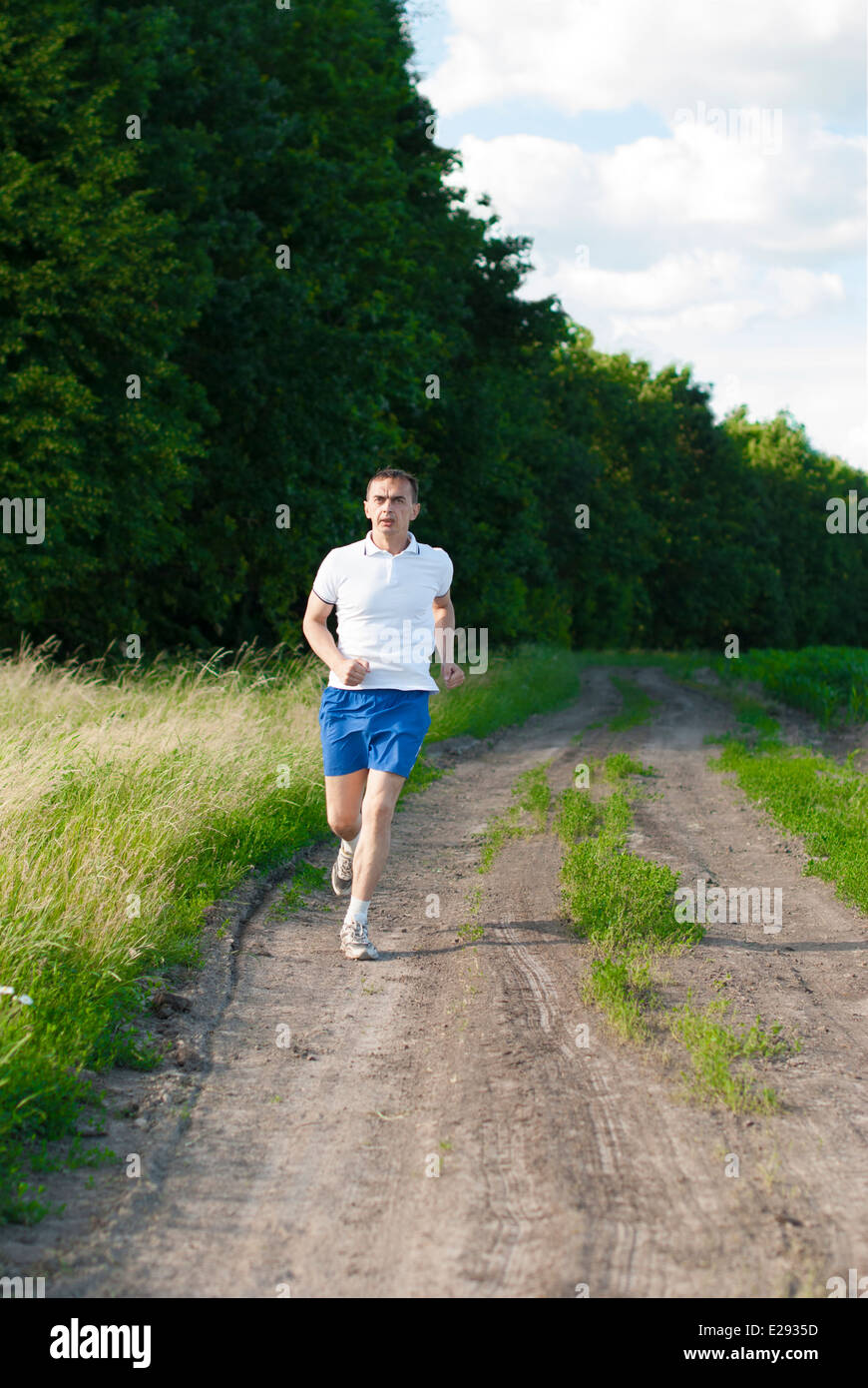 Sportsman running on the open countryside Stock Photo - Alamy