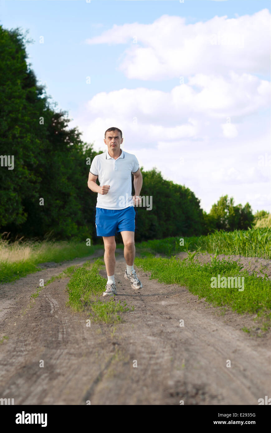 Sportsman running on the open countryside Stock Photo - Alamy