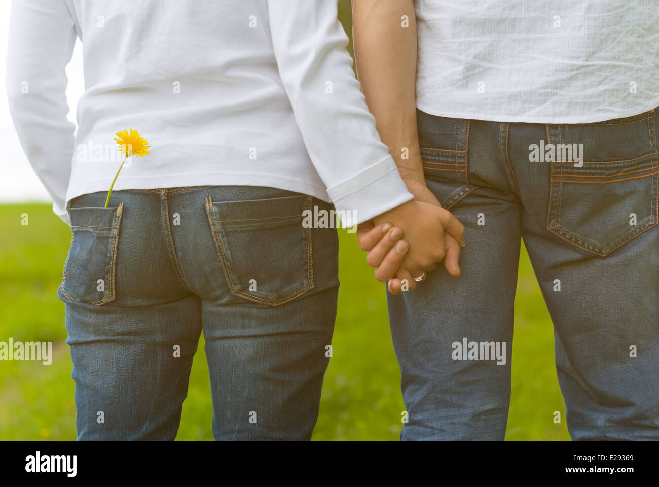 Couple of lovers holding hands Stock Photo - Alamy