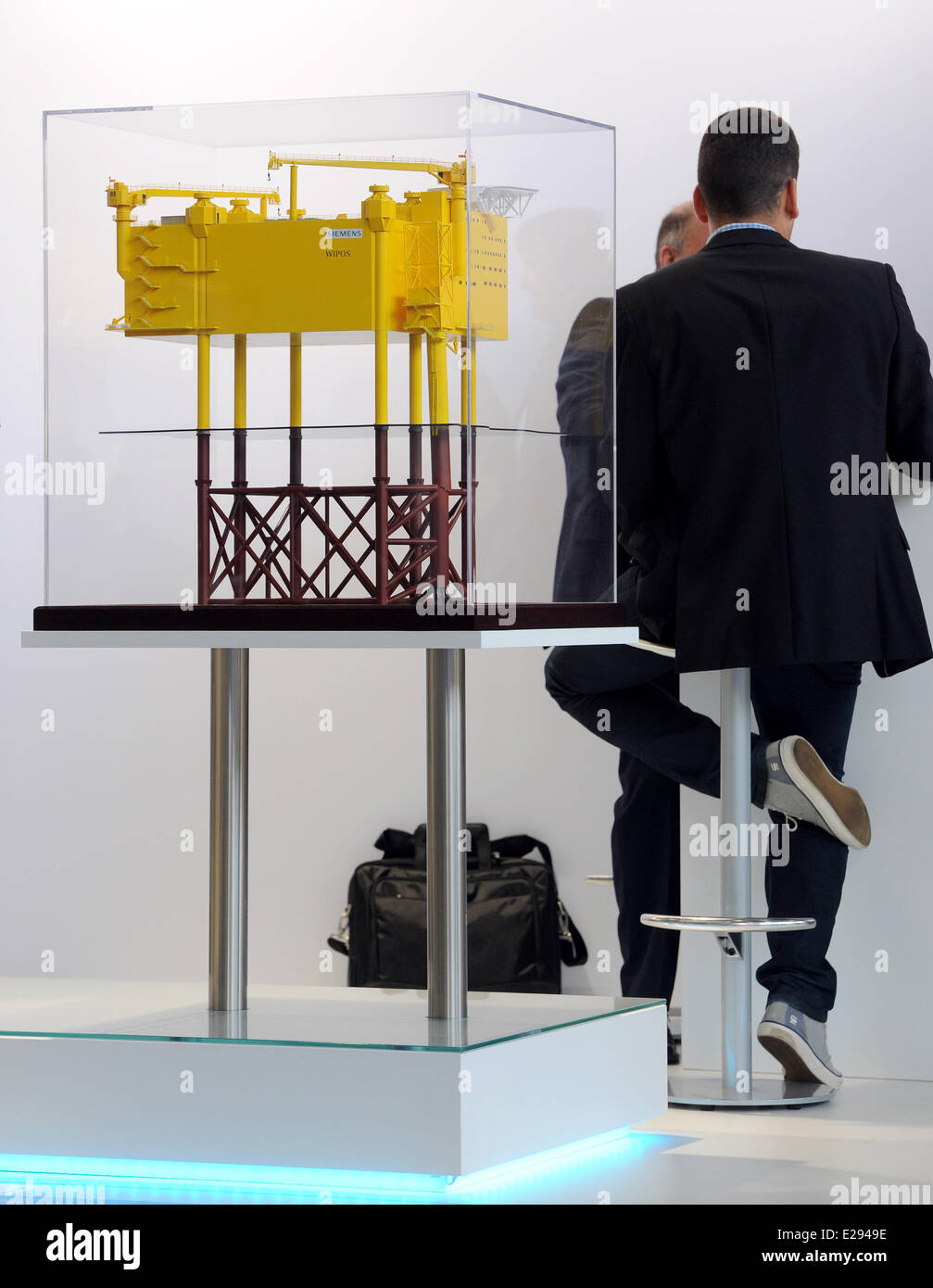 Bremen, Germany. 17th June, 2014. Experts discuss at the booth of ...