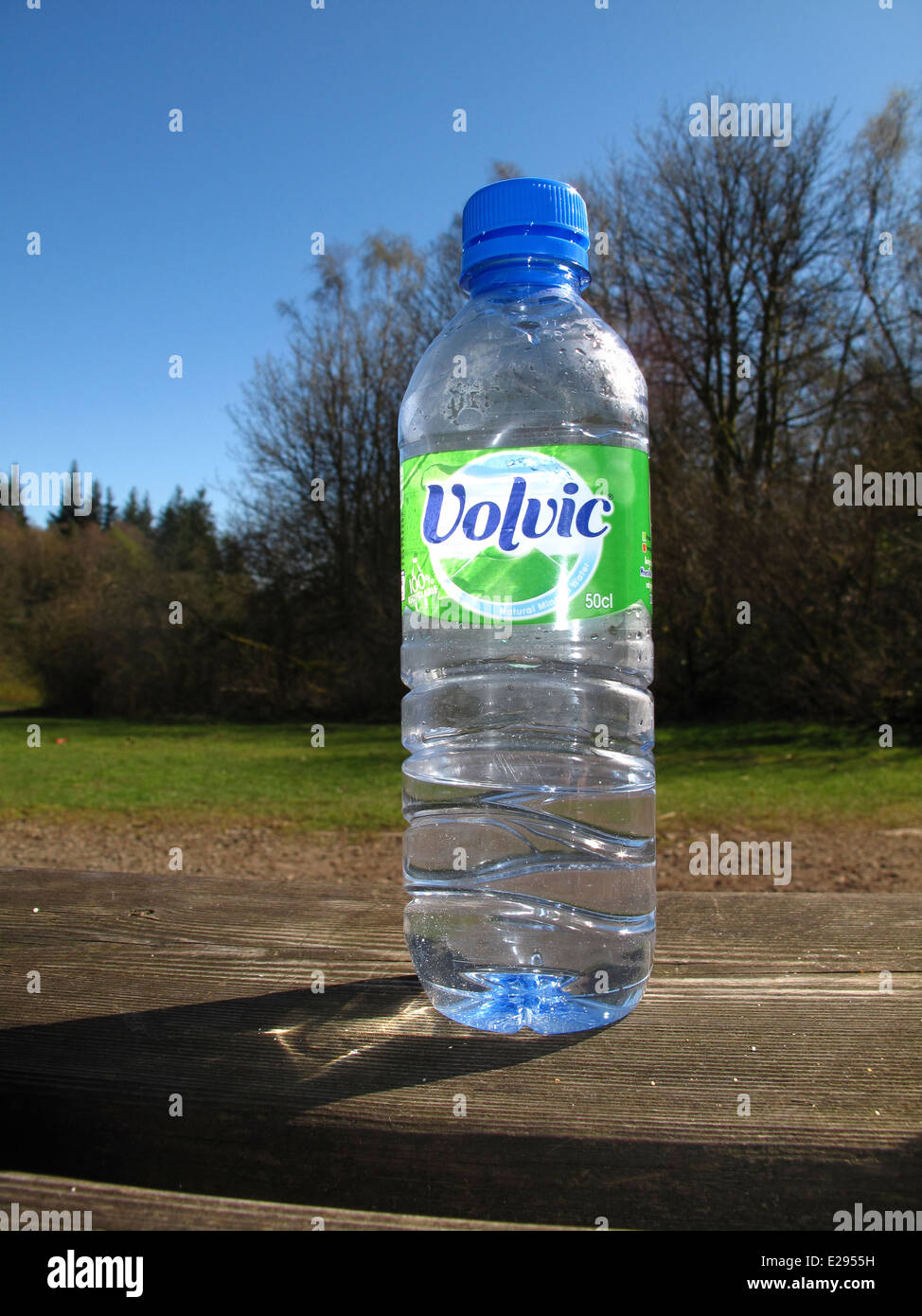 Backlit bottle of Volvic mineral water outside in sun Stock Photo - Alamy