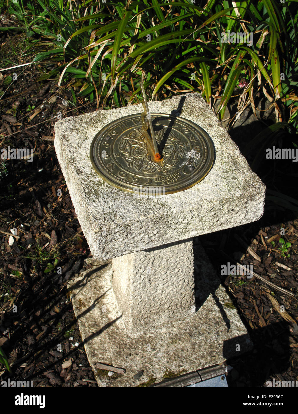 Small stone sundial garden ornament Stock Photo - Alamy