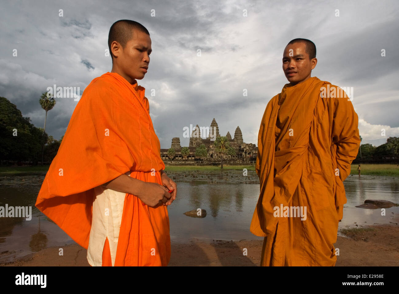 Two Buddhist monks on the outside of the Temple of Angkor Wat. Angkor ...