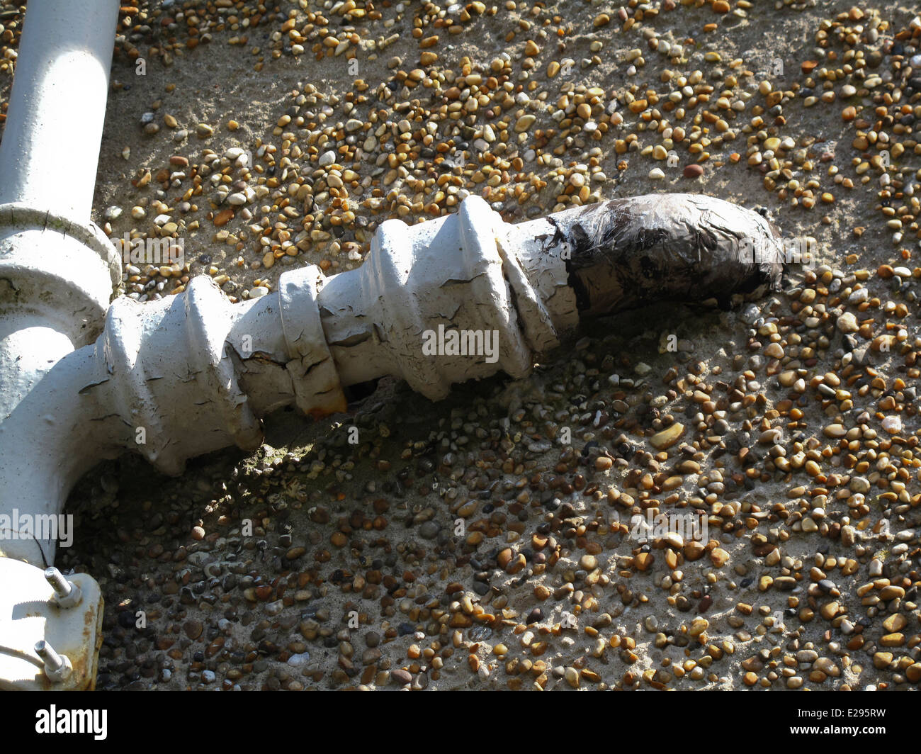 Corroded and repaired cast iron waste pipe on house Stock Photo - Alamy