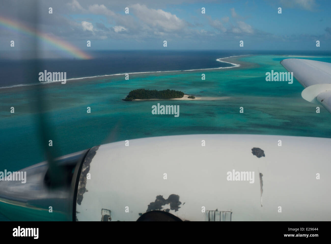 Aitutaki. Cook Island. Polynesia. South Pacific Ocean. A plane flies ...