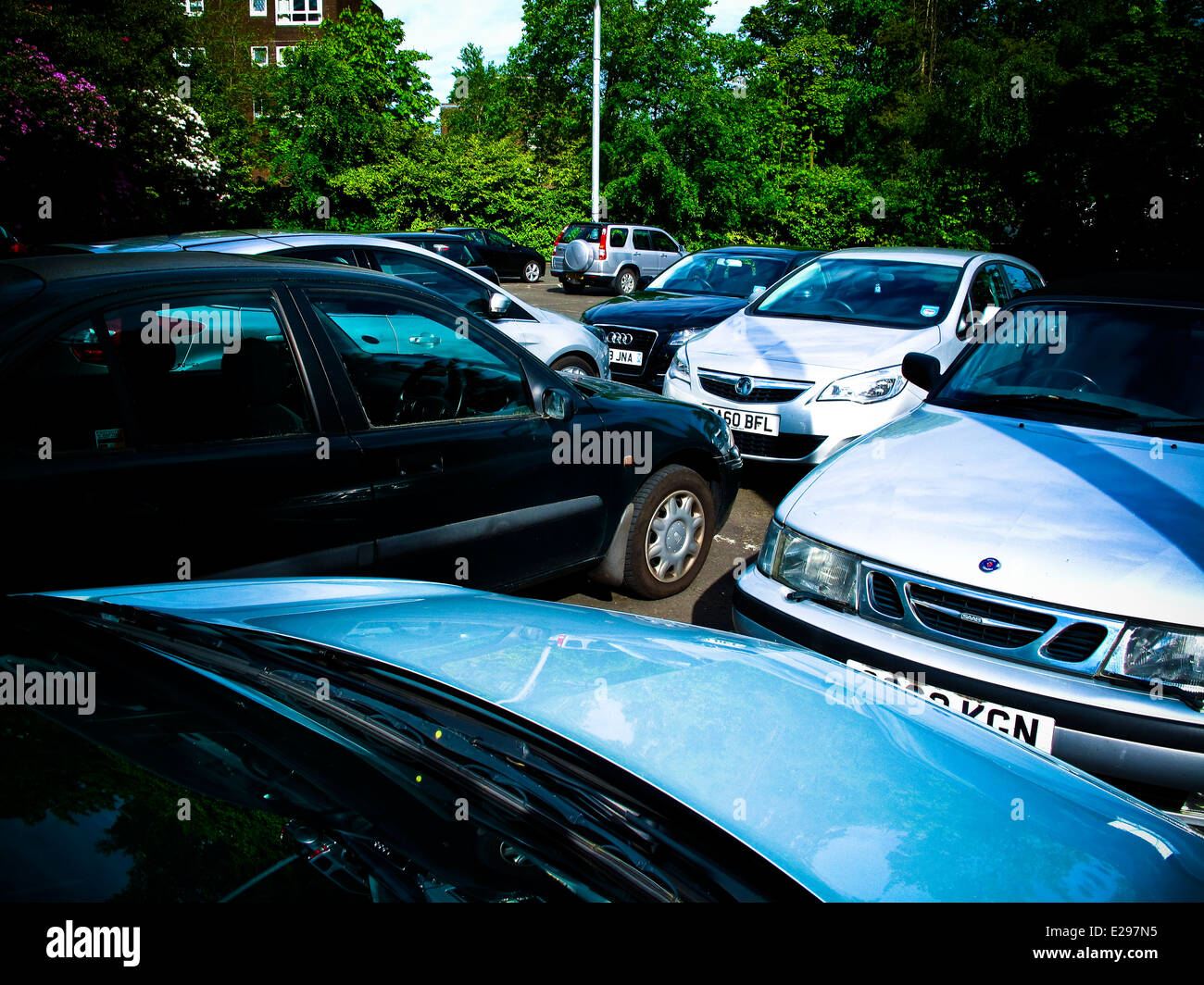 Cars parked at angles in car park Stock Photo - Alamy