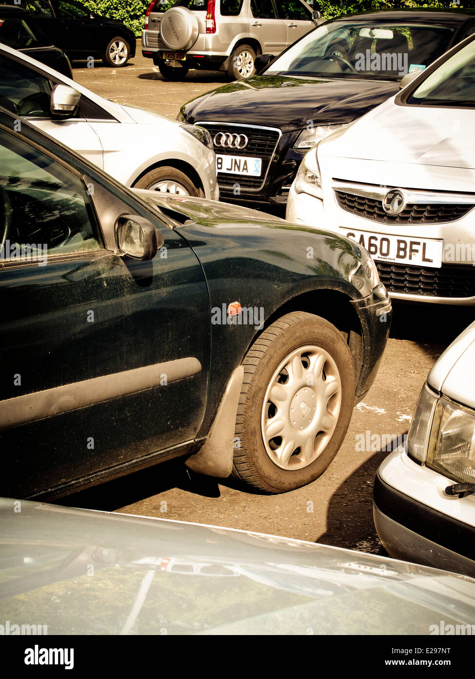 Cars parked at angles in car park Stock Photo - Alamy