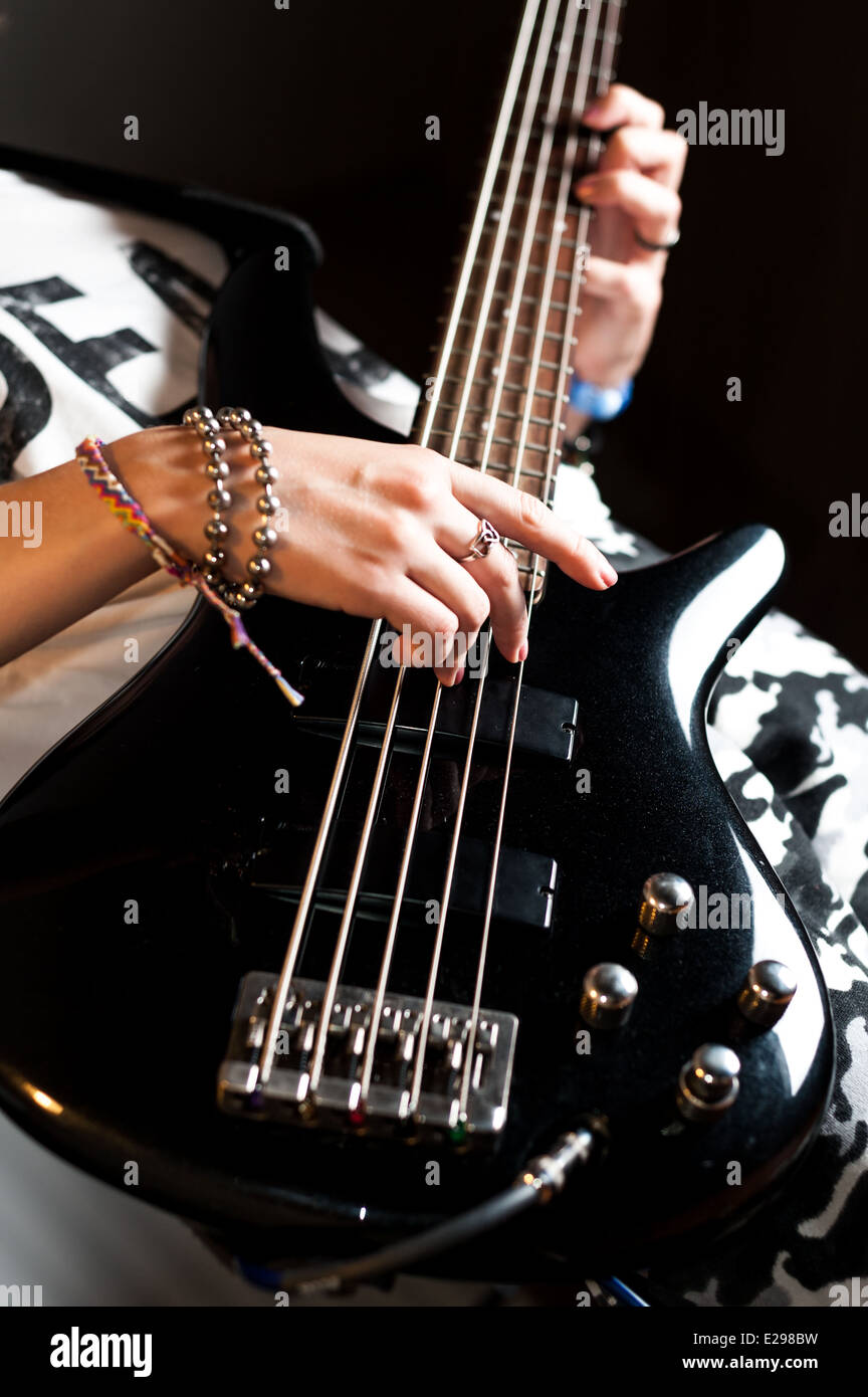 Girl Playing Bass guitar Stock Photo - Alamy
