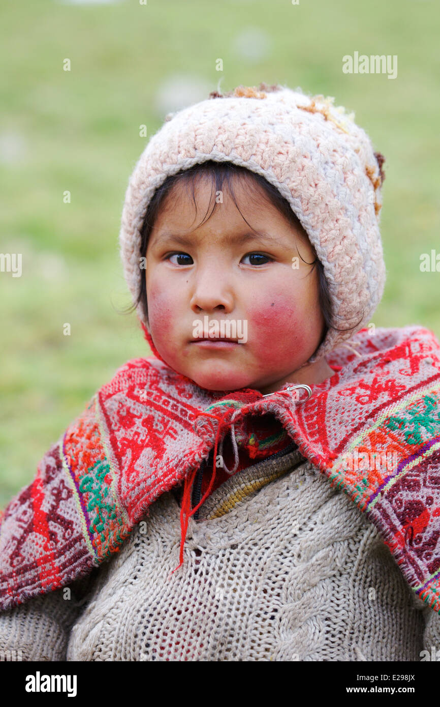 A portrait of a young Quechua girl in traditional native dress in the ...