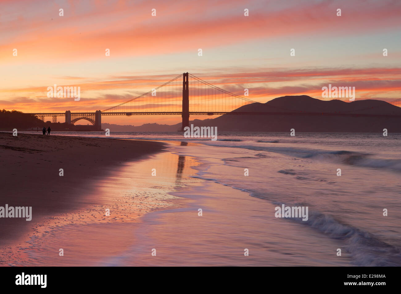 A beautiful sunset and the Golden Gate Bridge reflecting at Crissy ...