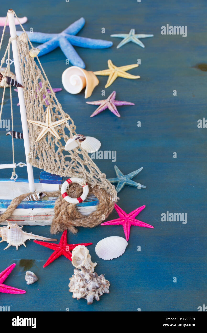 Seashells, starfish and boat Stock Photo - Alamy