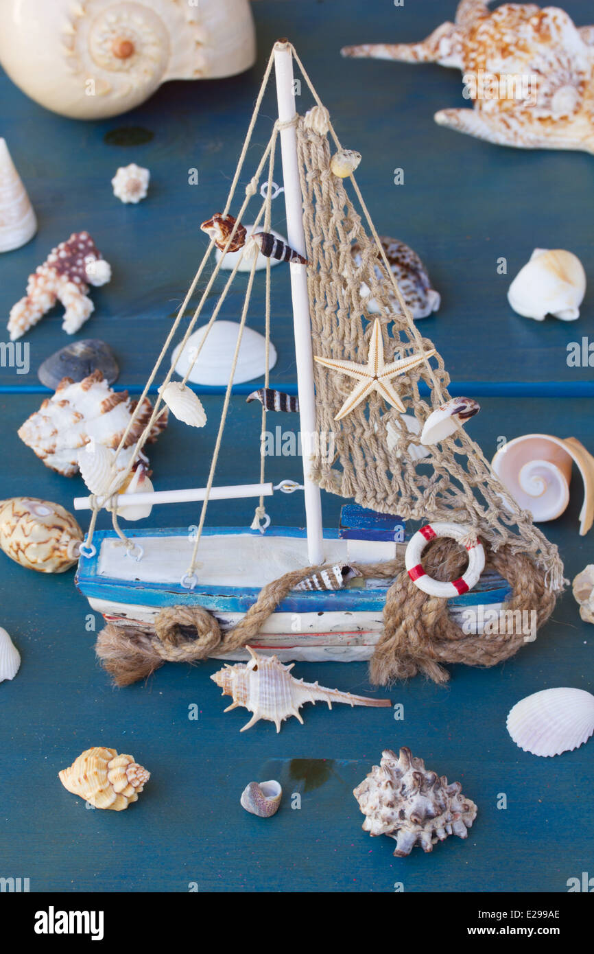Seashells and boat Stock Photo - Alamy