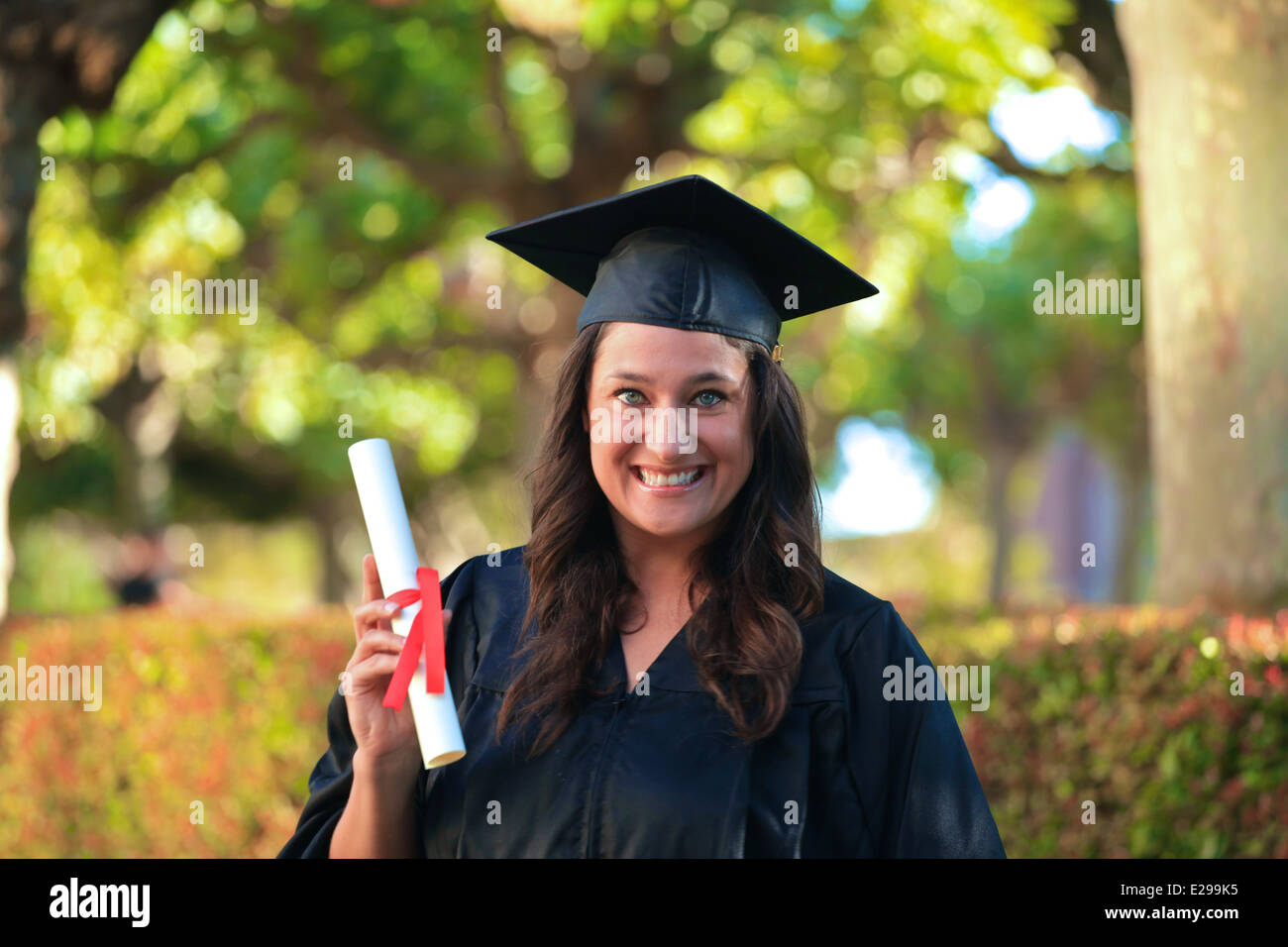 A beautiful girl with brown hair and blue eyes wearing a college ...
