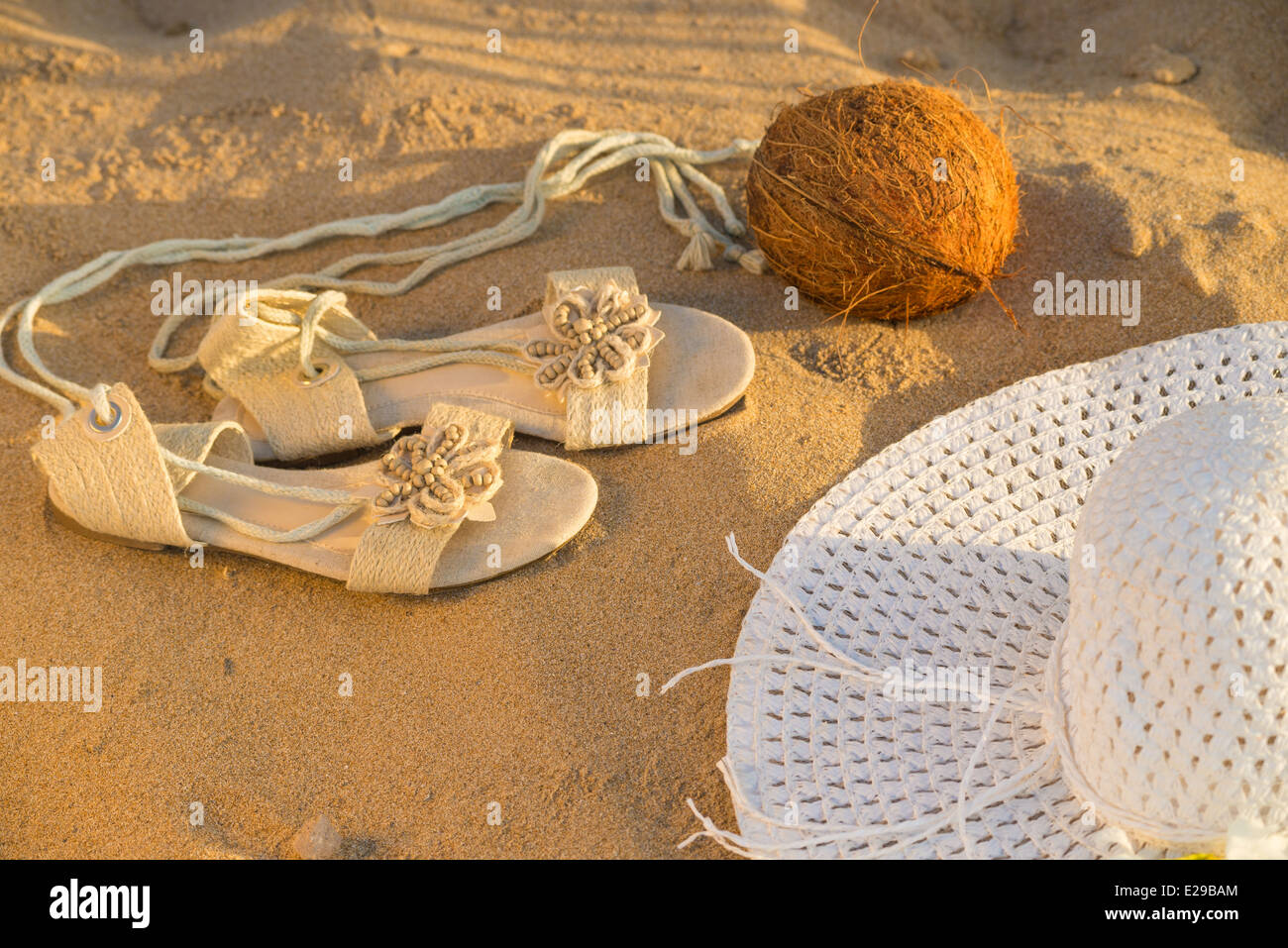 Still life with summer items on sunny golden sand Stock Photo - Alamy