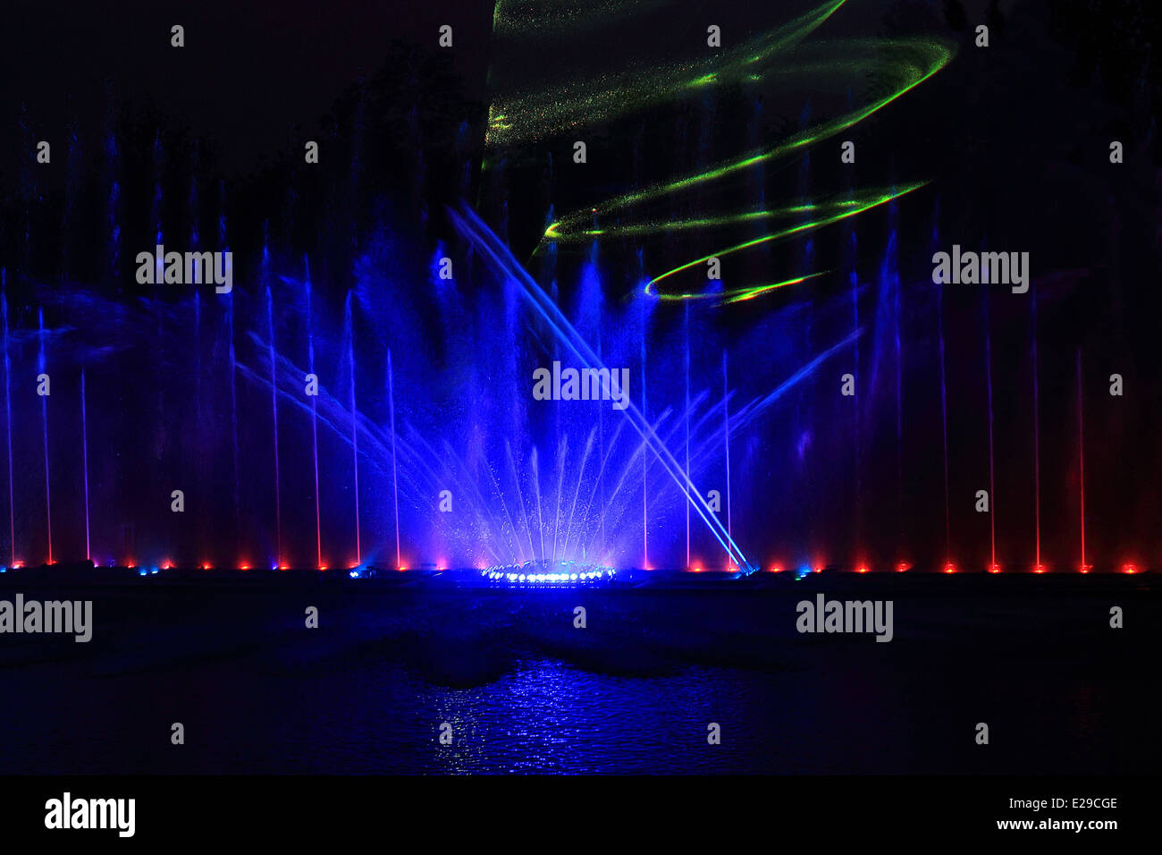 Color water fountain at night outdoor Stock Photo - Alamy