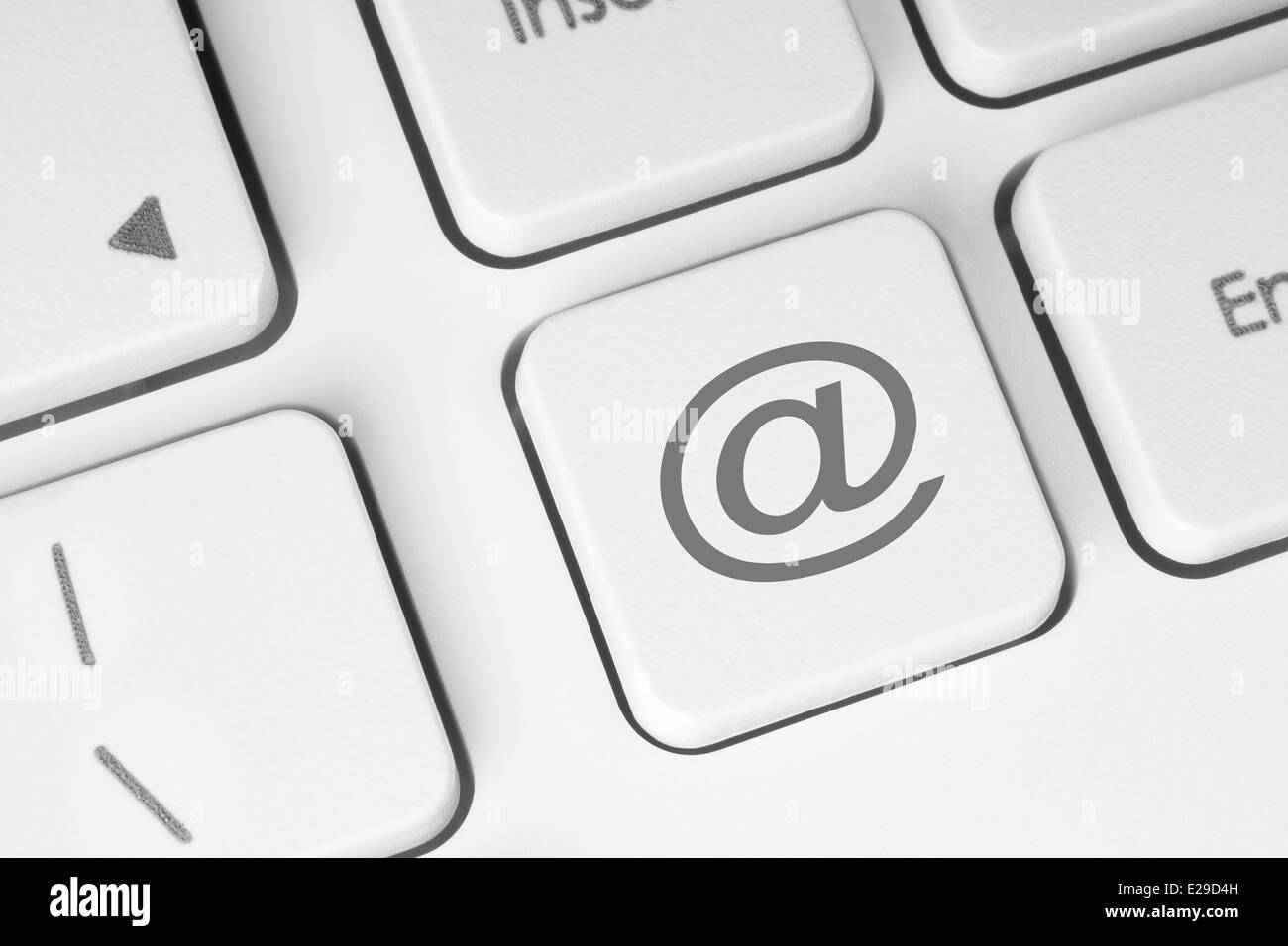 At symbol keyboard button close-up Stock Photo - Alamy