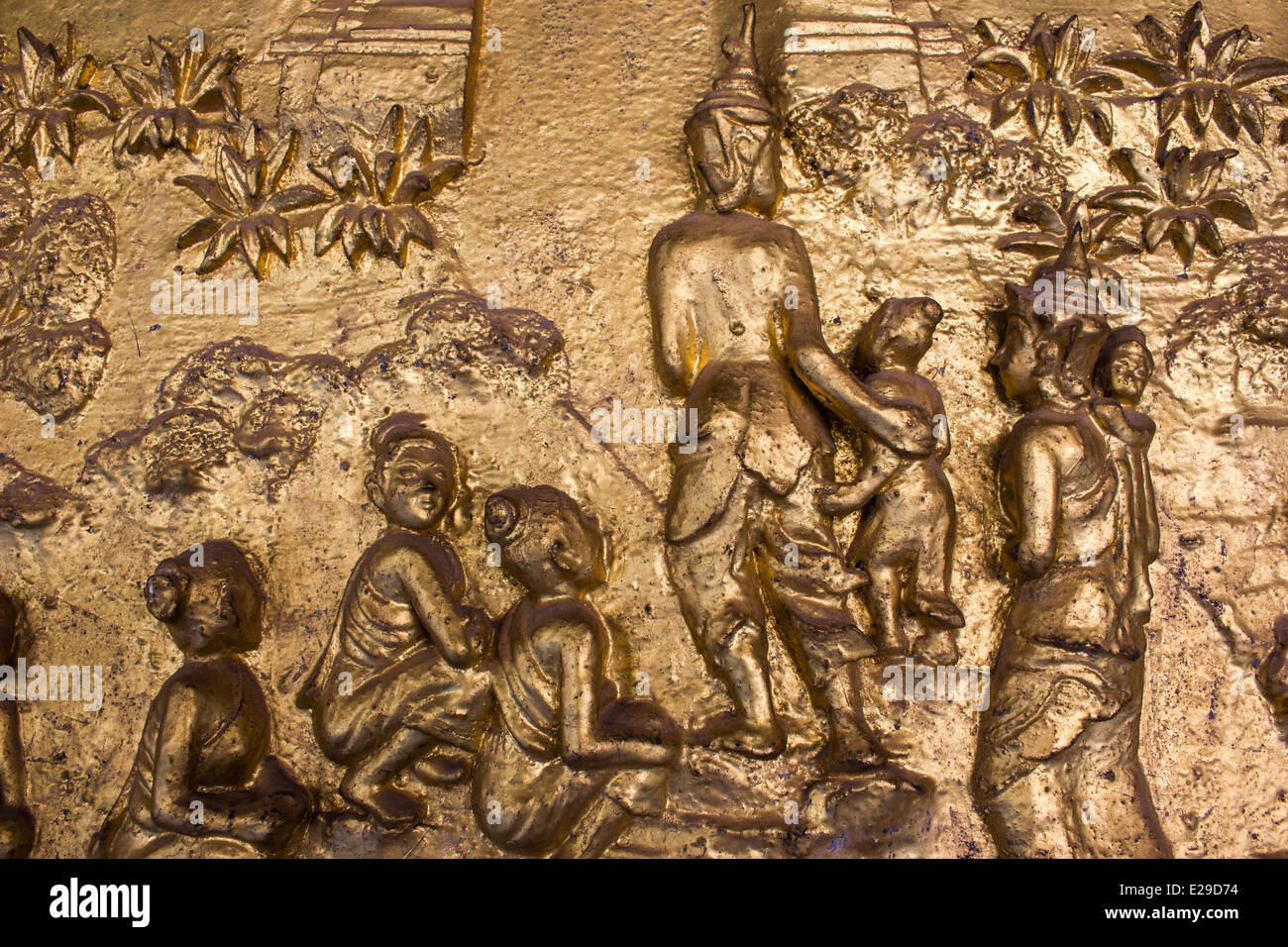 Laos temple bas relief gold buddha hi-res stock photography and images ...