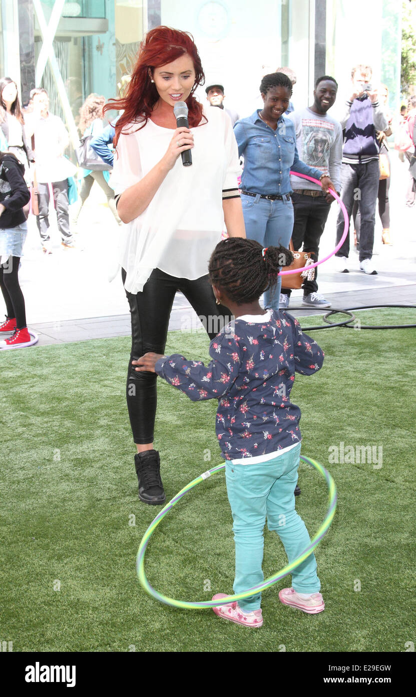 London, UK. 17th June, 2014. Amy Childs Hula Hoops as she launches 'Big ...