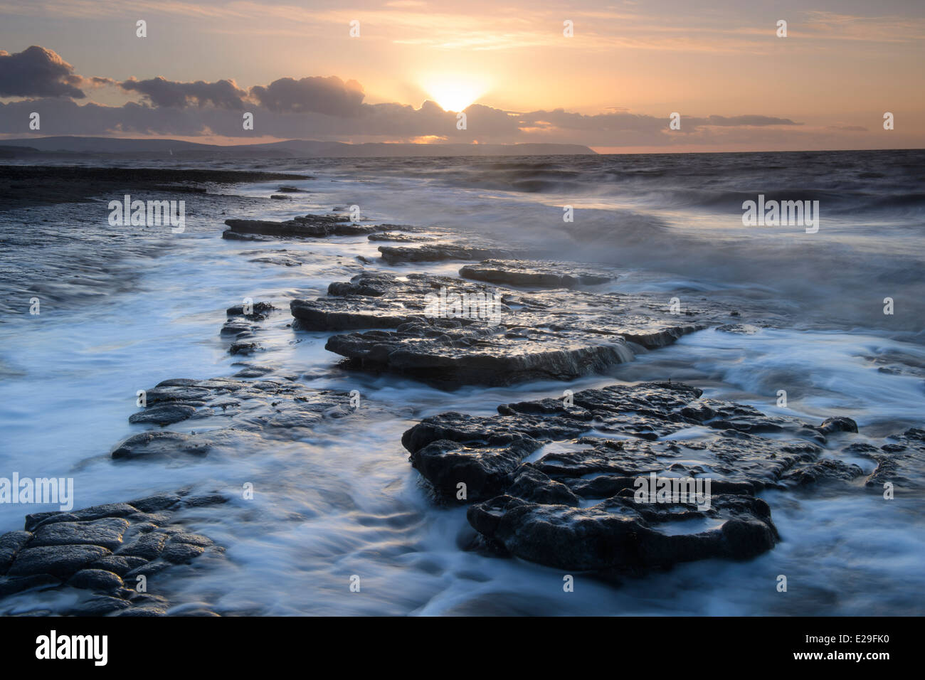 Low tide at Lilstock beach, Somerset, reveals cracked limestone ...
