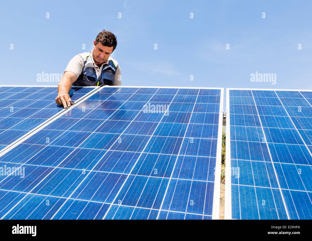 Professional installing electric solar panels Stock Photo - Alamy
