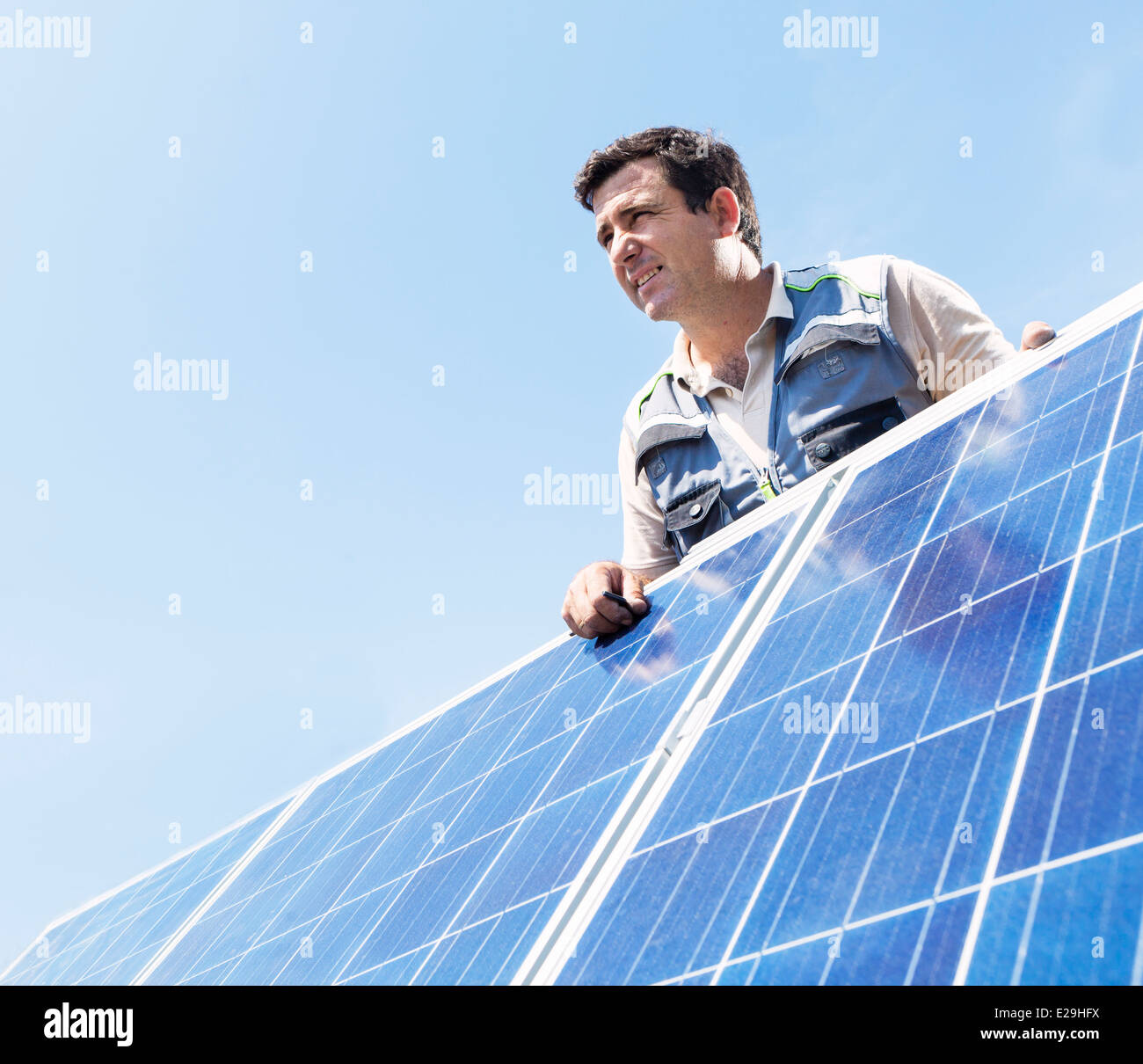 Professional installing electric solar panels Stock Photo - Alamy