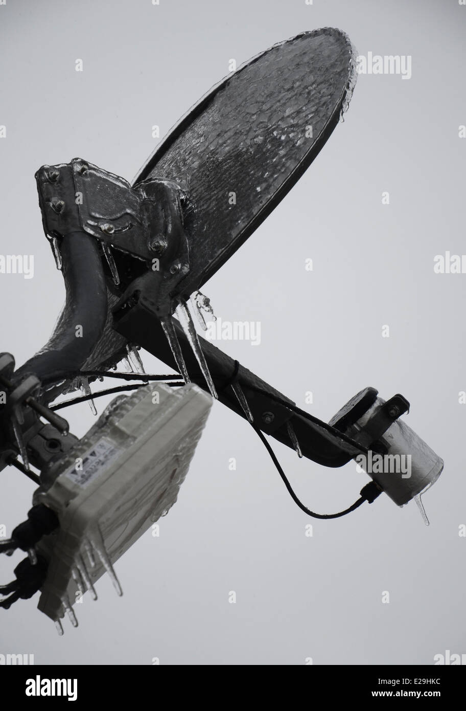 Satellite dish covered in ice Stock Photo - Alamy