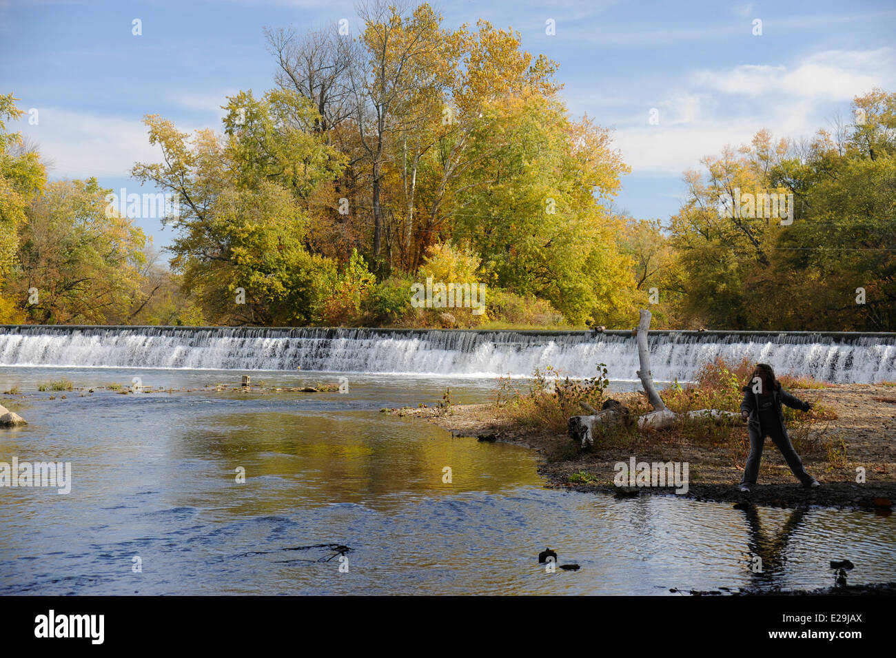 Child skipping rocks in the Big Blue River in Edinburgh, Indiana Stock ...