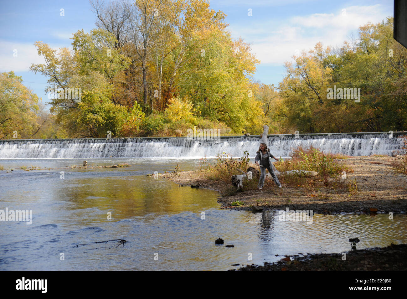 Child skipping rocks in the Big Blue River in Edinburgh, Indiana Stock ...
