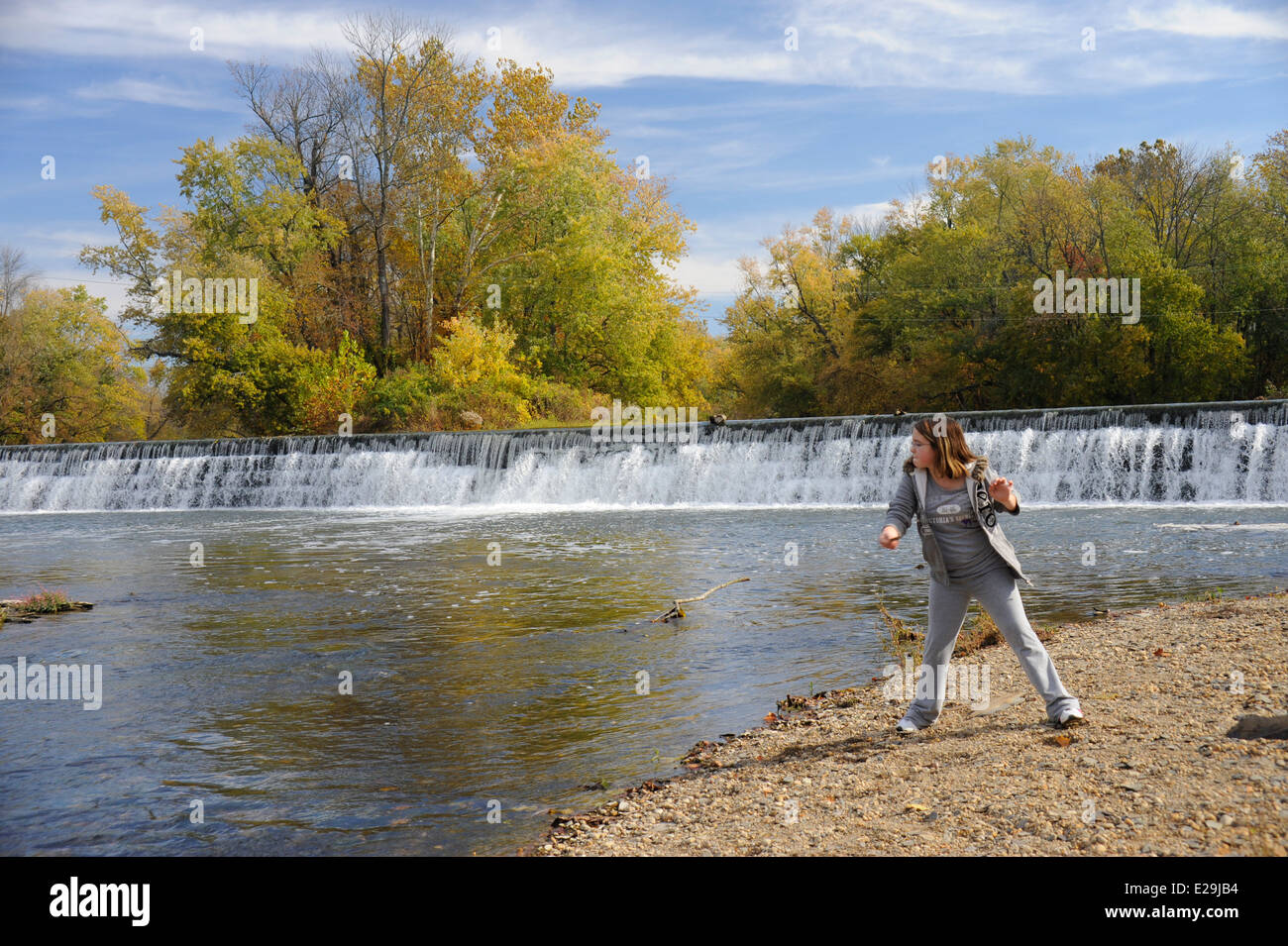 Child skipping rocks in the Big Blue River in Edinburgh, Indiana Stock ...