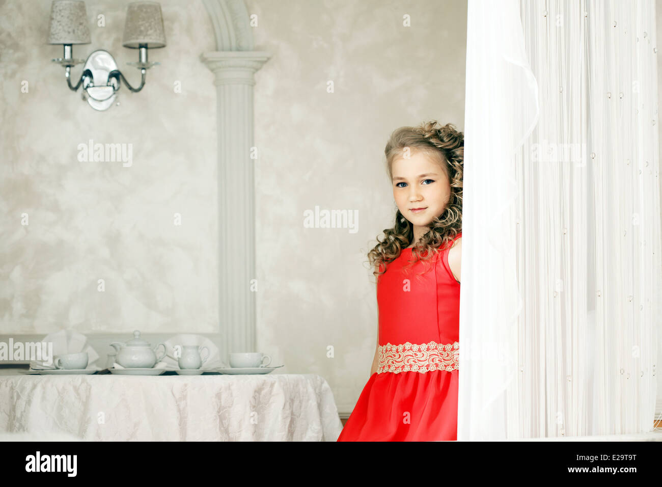 Image of elegant little lady posing in restaurant Stock Photo - Alamy