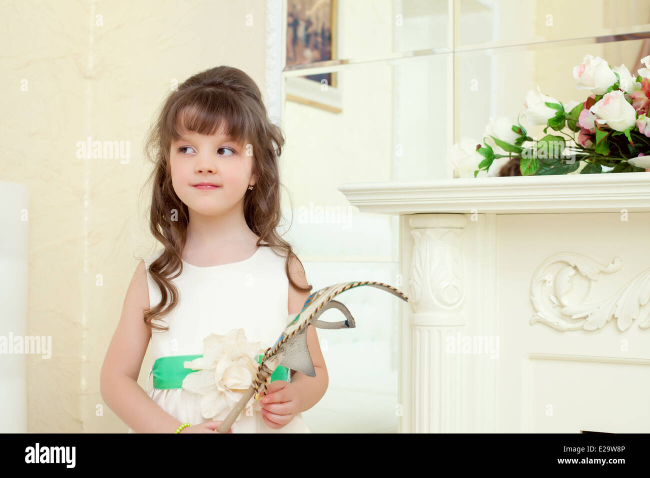 Smiling little lady posing with carnival mask Stock Photo - Alamy