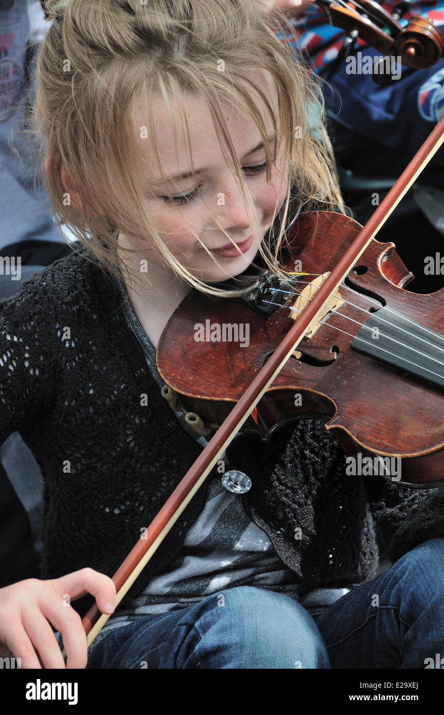 Ireland, County Clare, Milltown Malbay, Little girl playing fiddle ...
