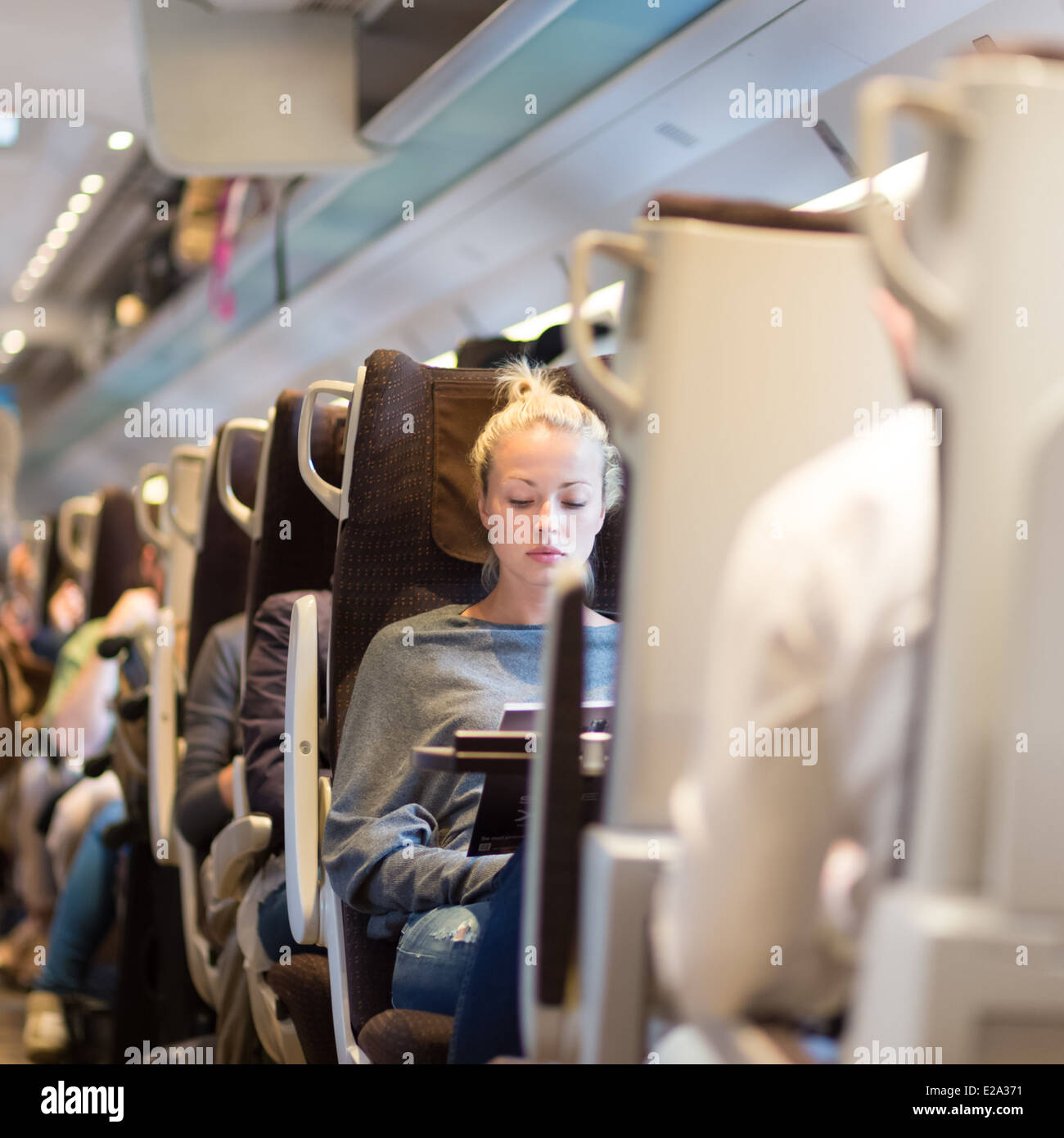 Lady traveling by train Stock Photo - Alamy