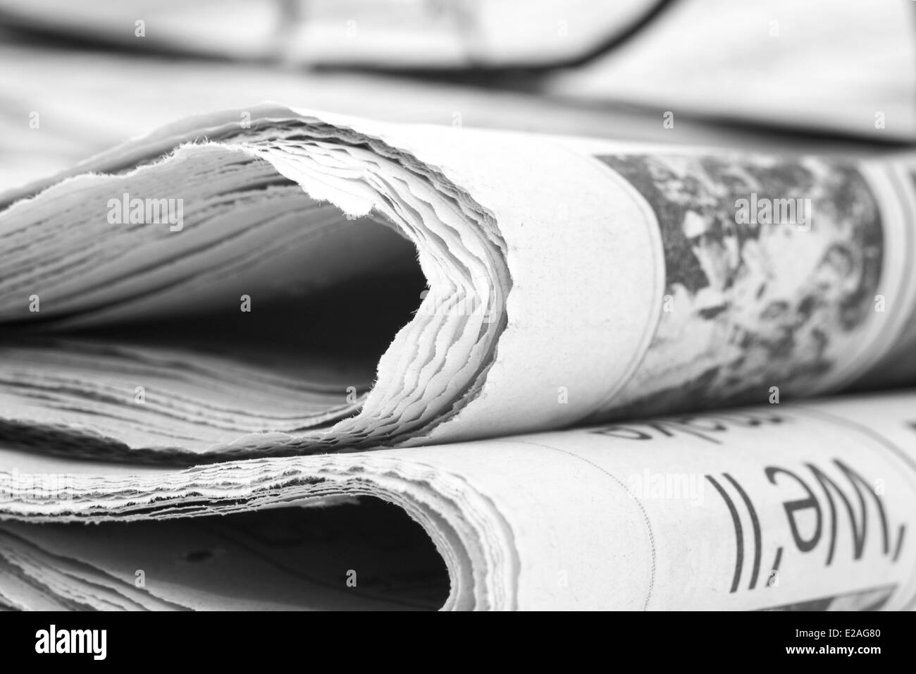Newspaperfolded up with specs Stock Photo - Alamy