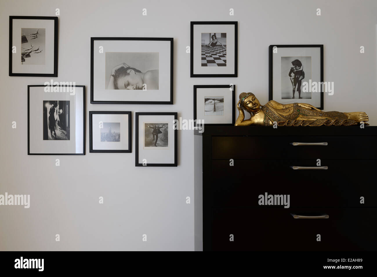 Framed photos on a wall Stock Photo - Alamy