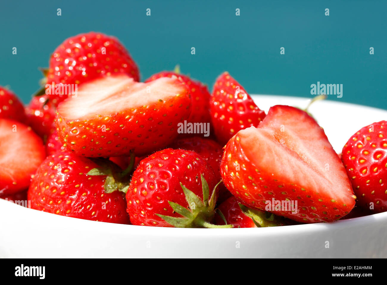 Bowl of Strawberries by the Ocean Stock Photo - Alamy