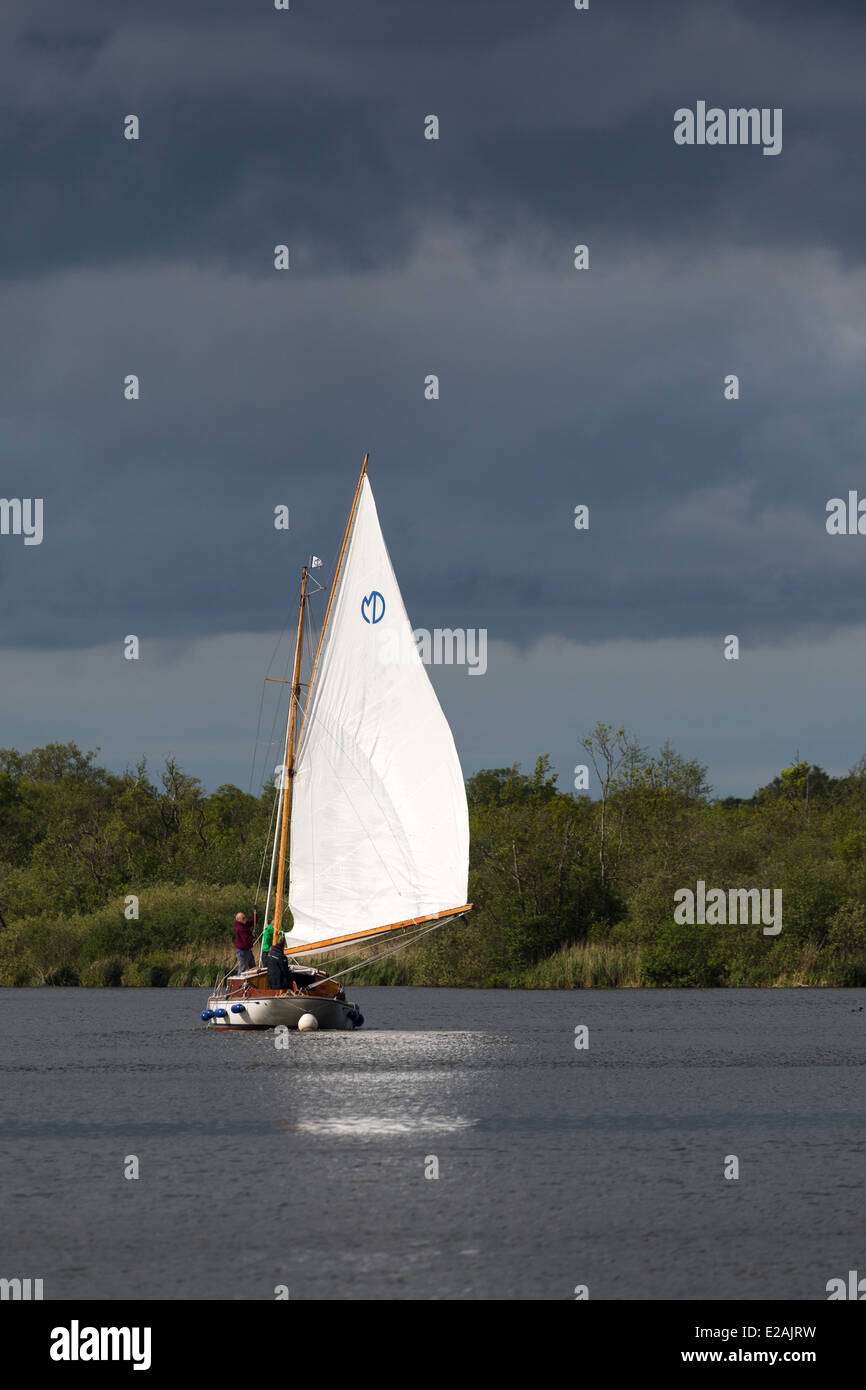 raising sails on yacht. Malthouse Broad Ranworth Norfolk Broads England ...