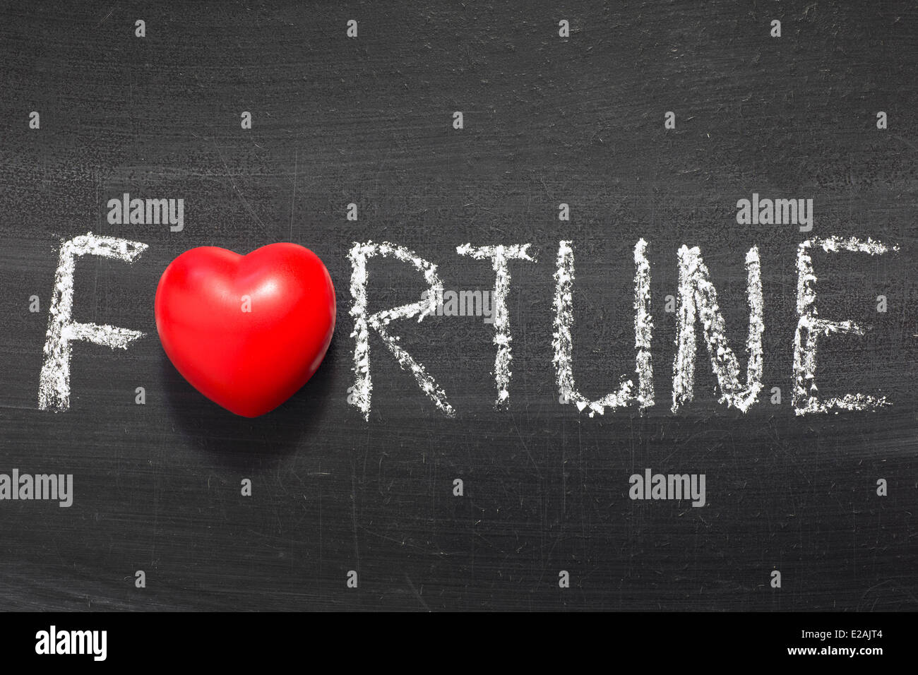 fortune word handwritten on chalkboard with heart symbol instead of O ...