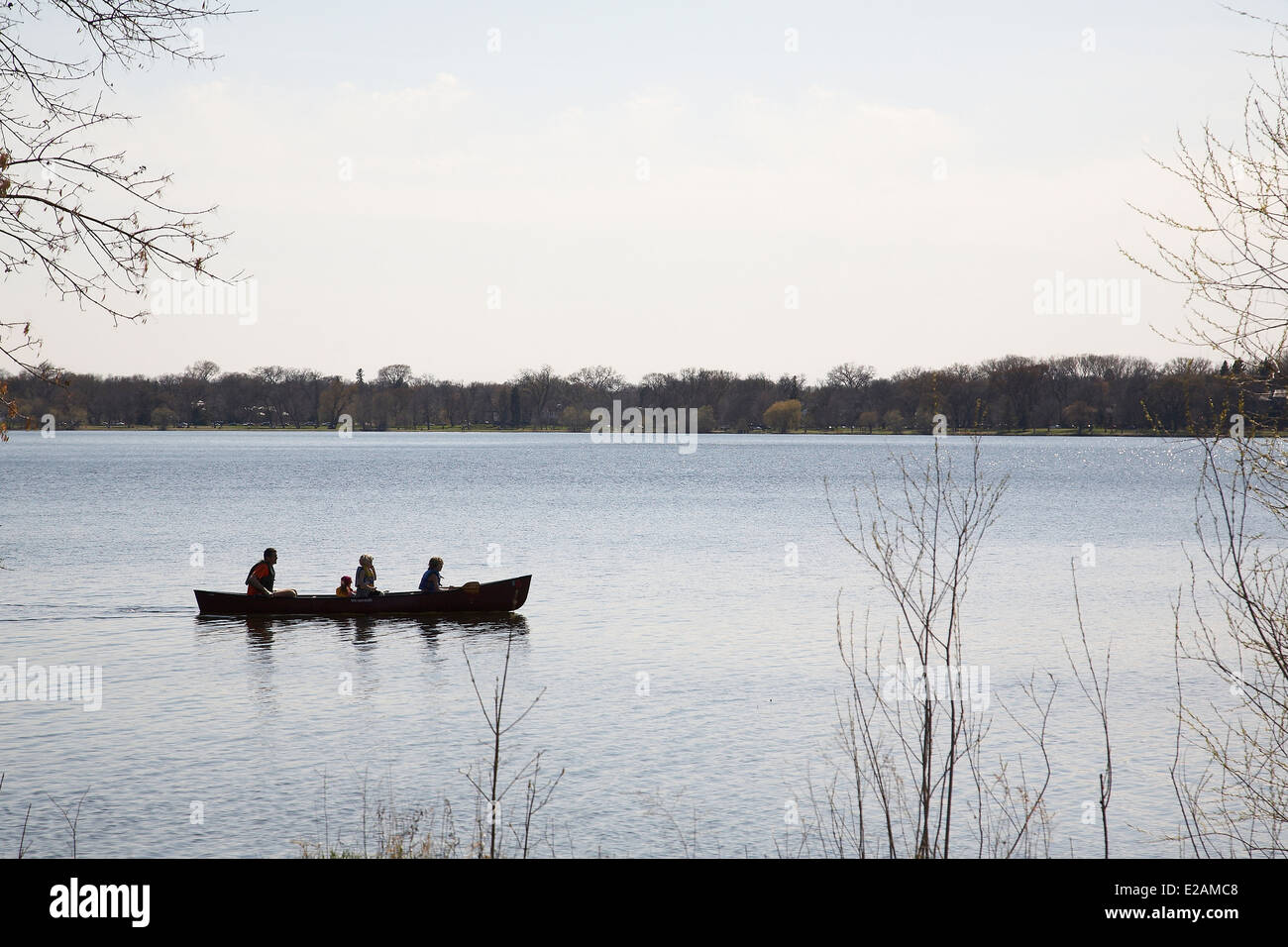 A Father and his three children in a canoe on Lake Calhoun, Minneapolis ...