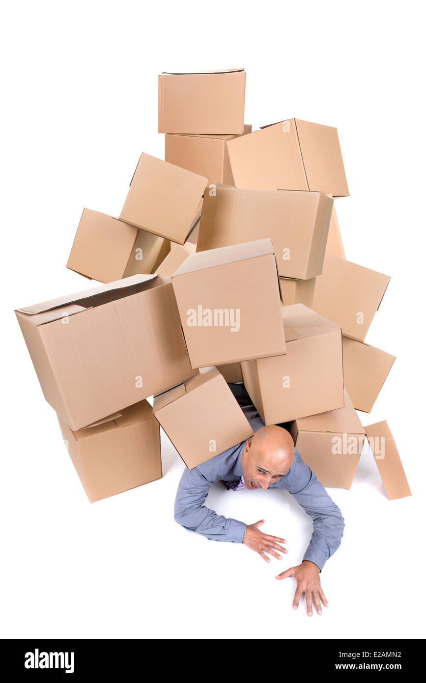 Stressed businessman under a pile of cardboard boxes Stock Photo - Alamy